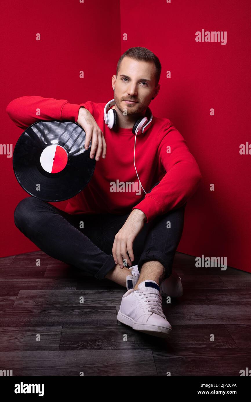 Man sitting on record collection hi-res stock photography and images ...
