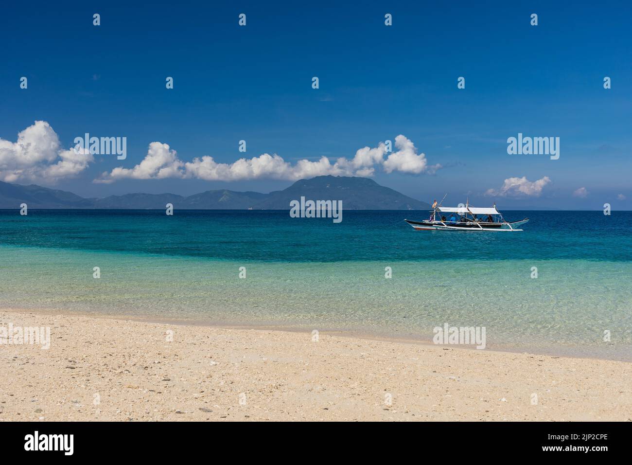 A boat on the water by the Bon Bon beach in Romblon, Philippines Stock ...