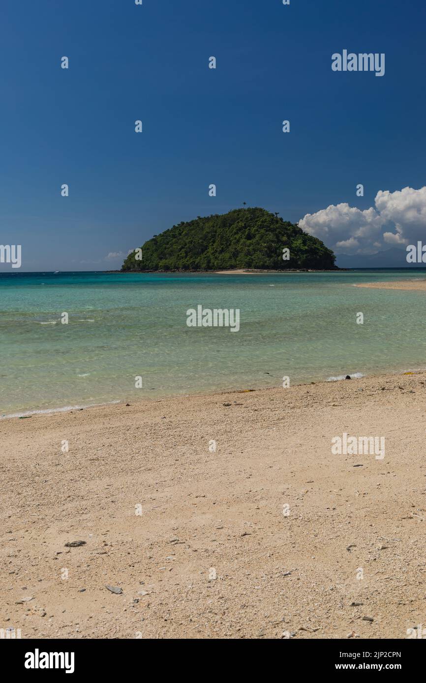A blue sky over an island with blue ocean water Stock Photo - Alamy