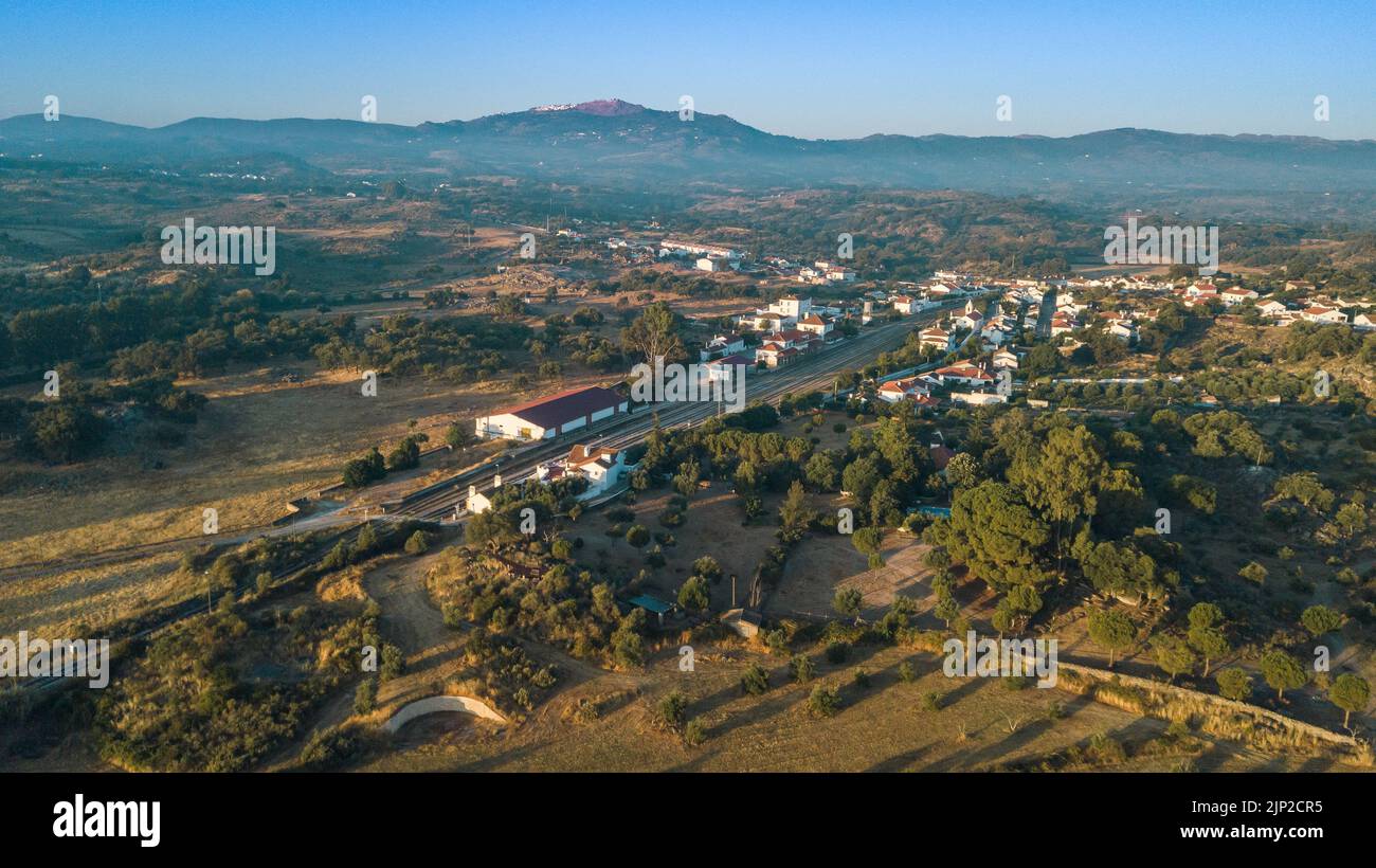 An aerial view of the Beira old train station surrounded by trees and ...