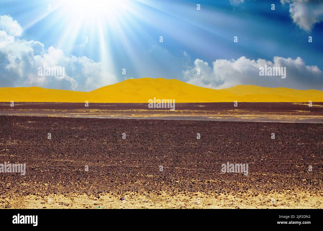 Beautiful wide vast arid dry moroccan desert landscape, black scorched earth, yellow sand dunes ...