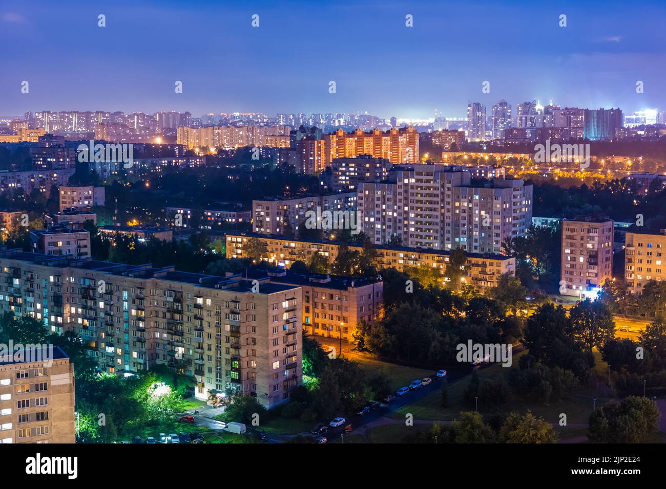 Night colorful windows lights of the high-rise residential building in ...