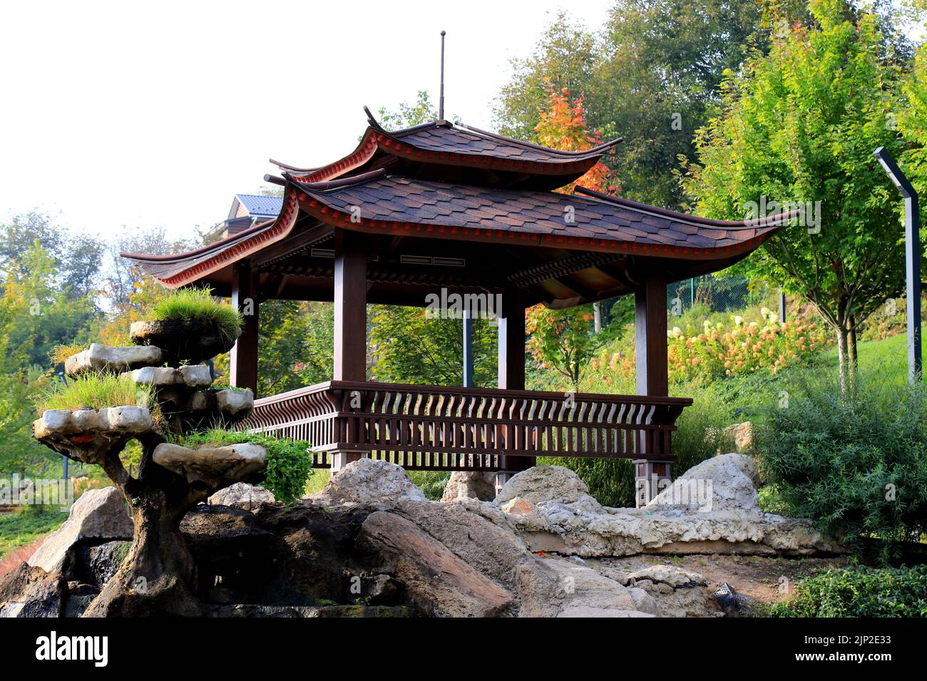 A beautiful landscape park, lake, wooden pavilions in Japanese style ...