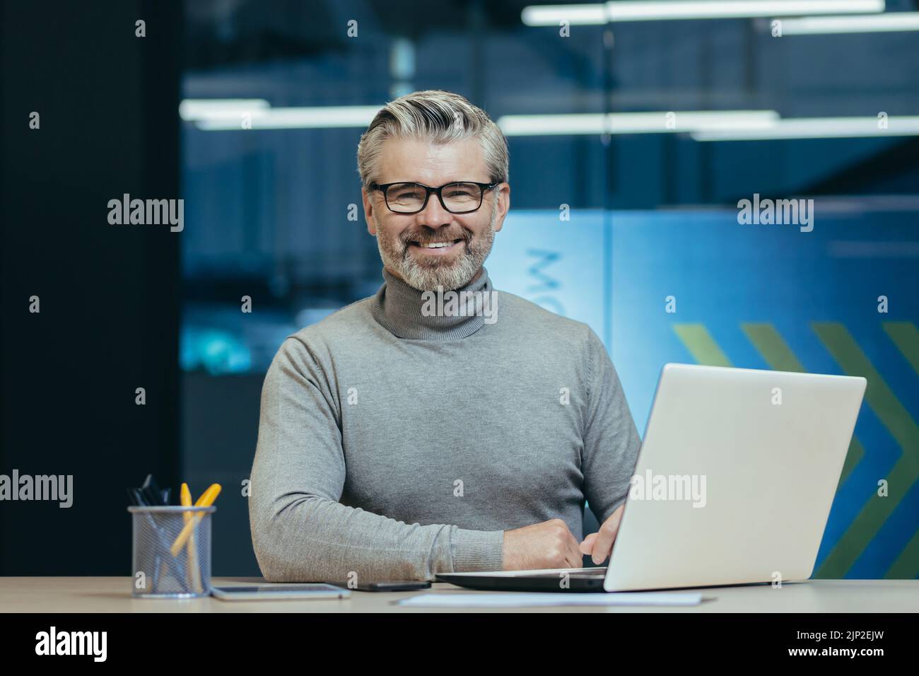 Portrait of successful businessman in modern office, senior mature gray ...