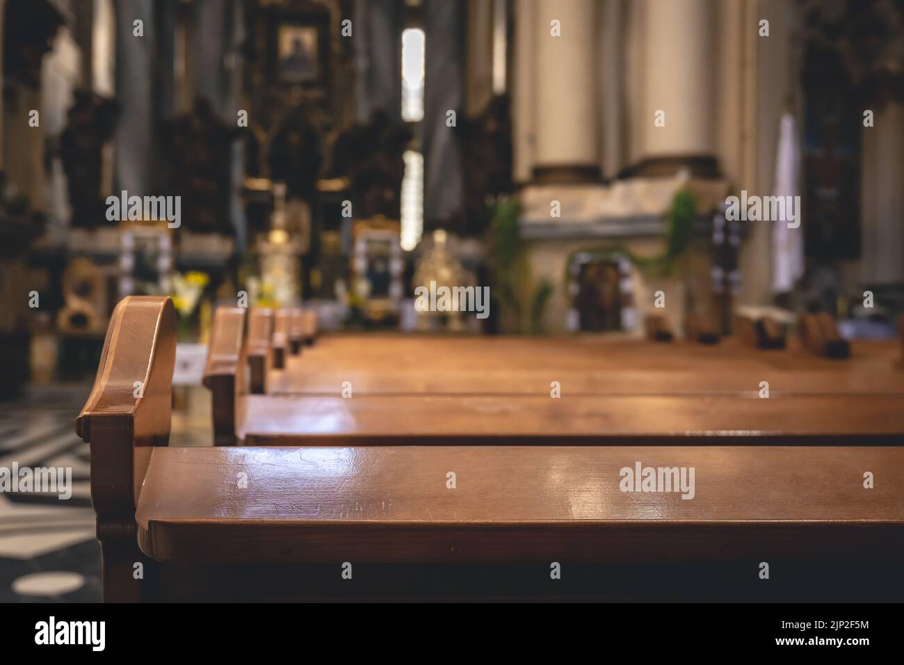 Interior details of a Catholic church with wooden benches Stock Photo ...