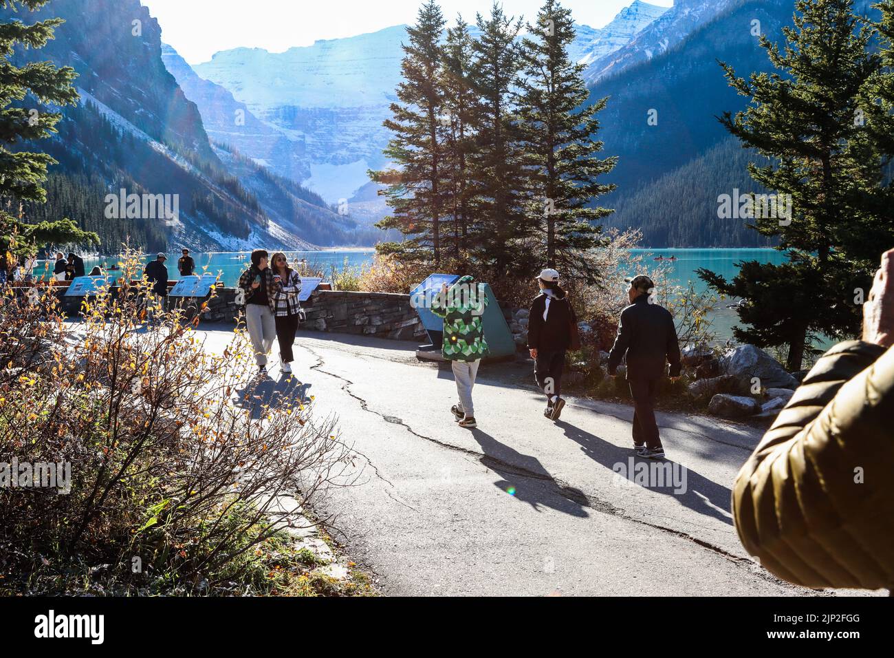 The tourists walking near Lake Louise in Banff National Park, Canada ...