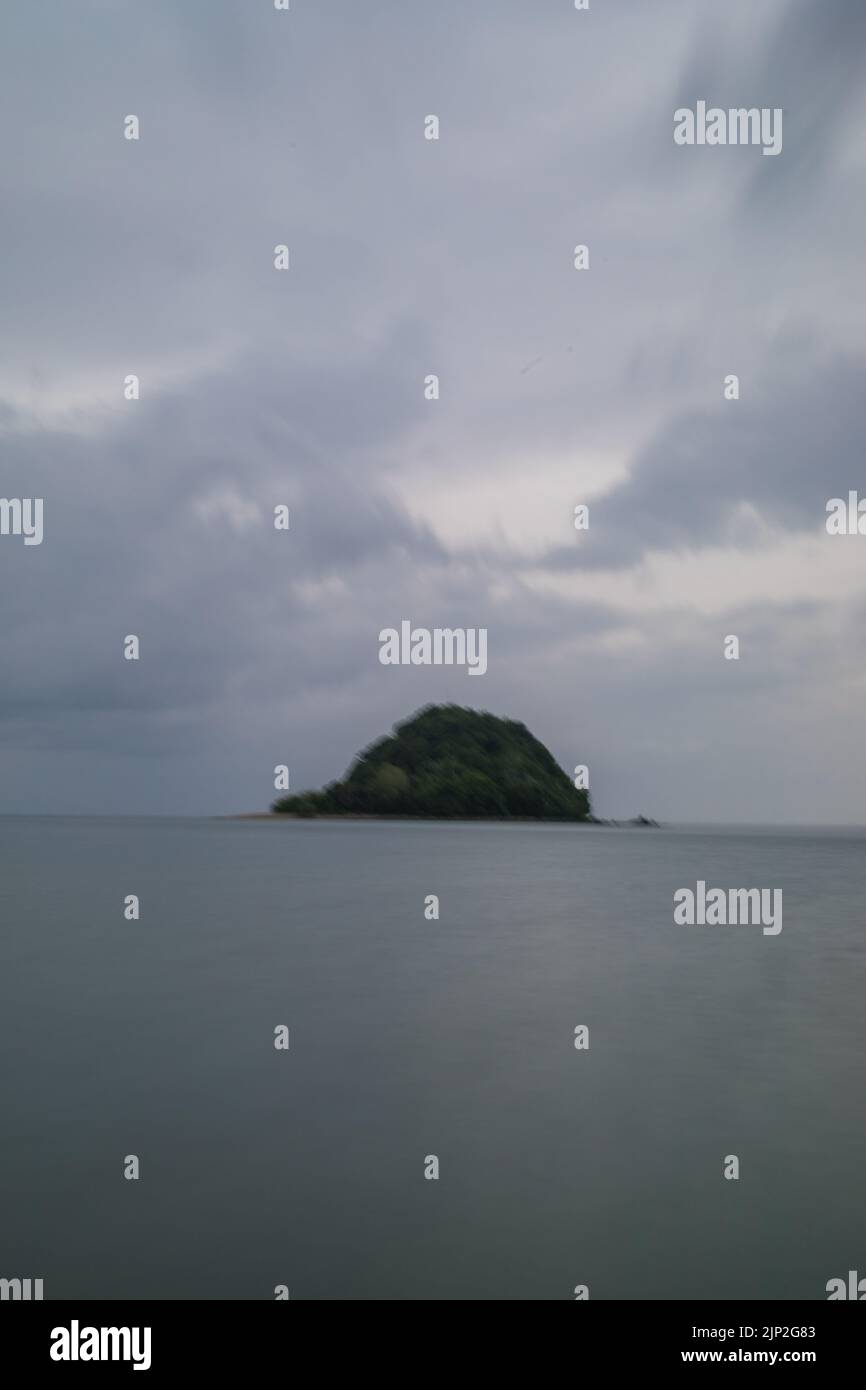 A scenic view of a calm coast and the island of Romblon in the ...