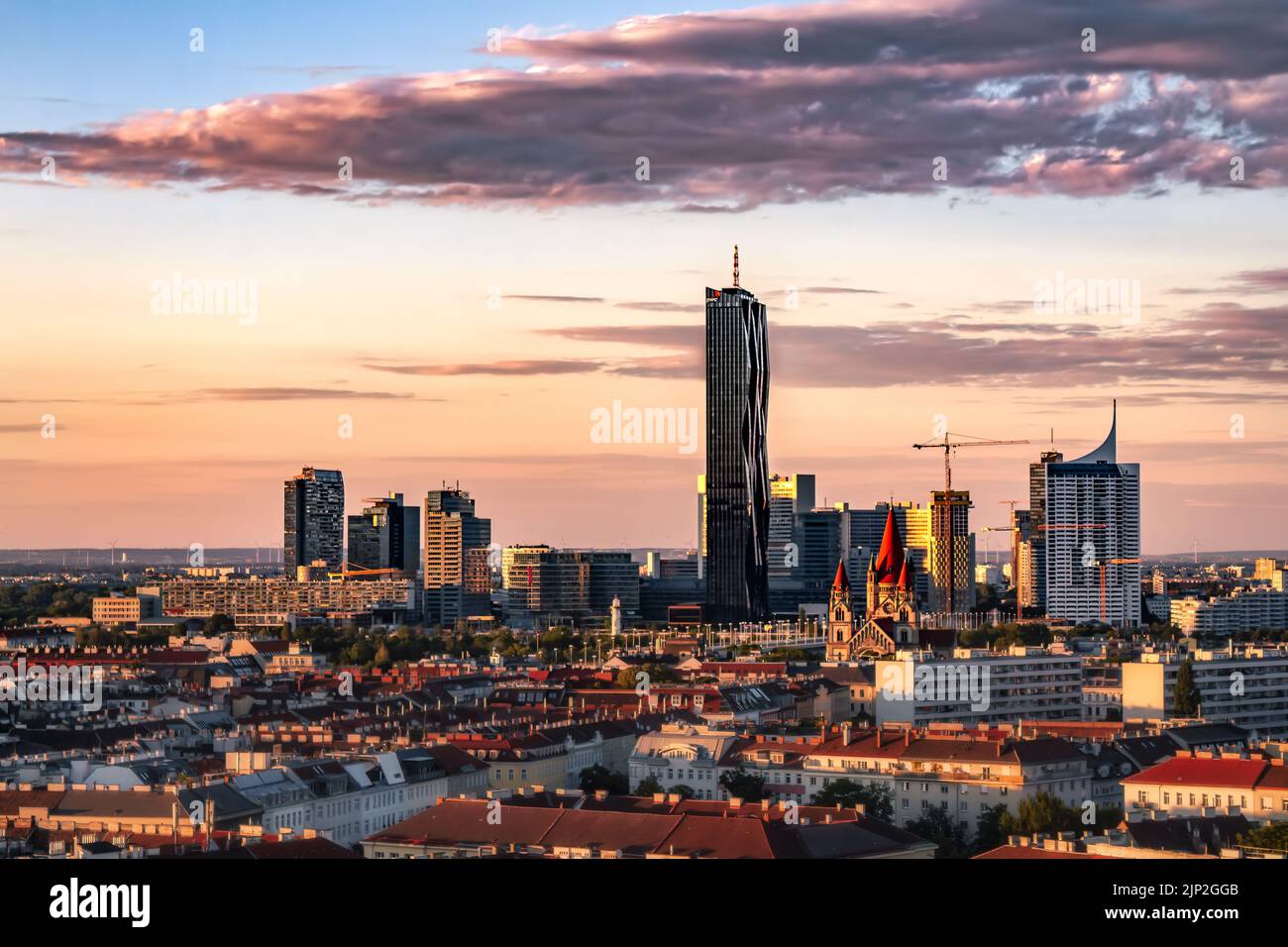 A breathtaking view of Vienna, Austria before sunset with pink clouds ...