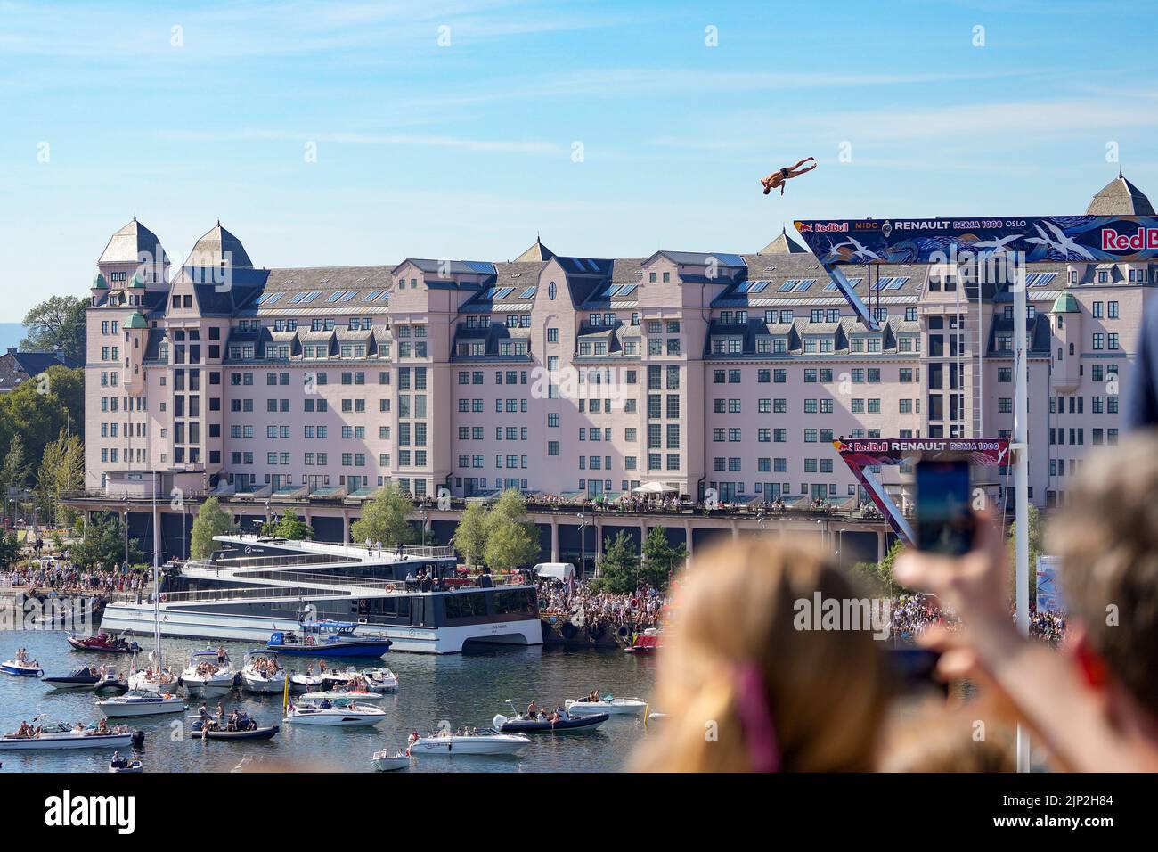 Oslo 20220813.The audience watches as cliff divers from all over the ...