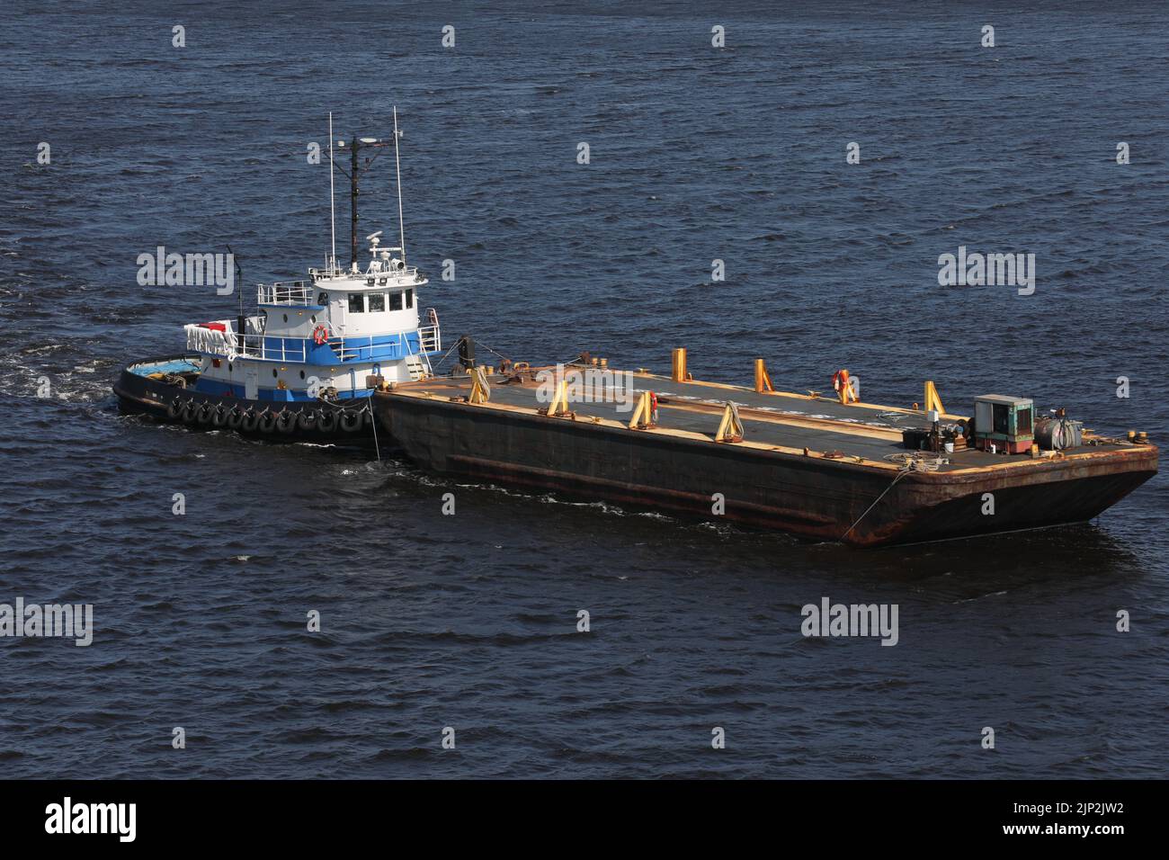 view of Tugboat pushing a heavy barge on the sea, florida usa Stock ...