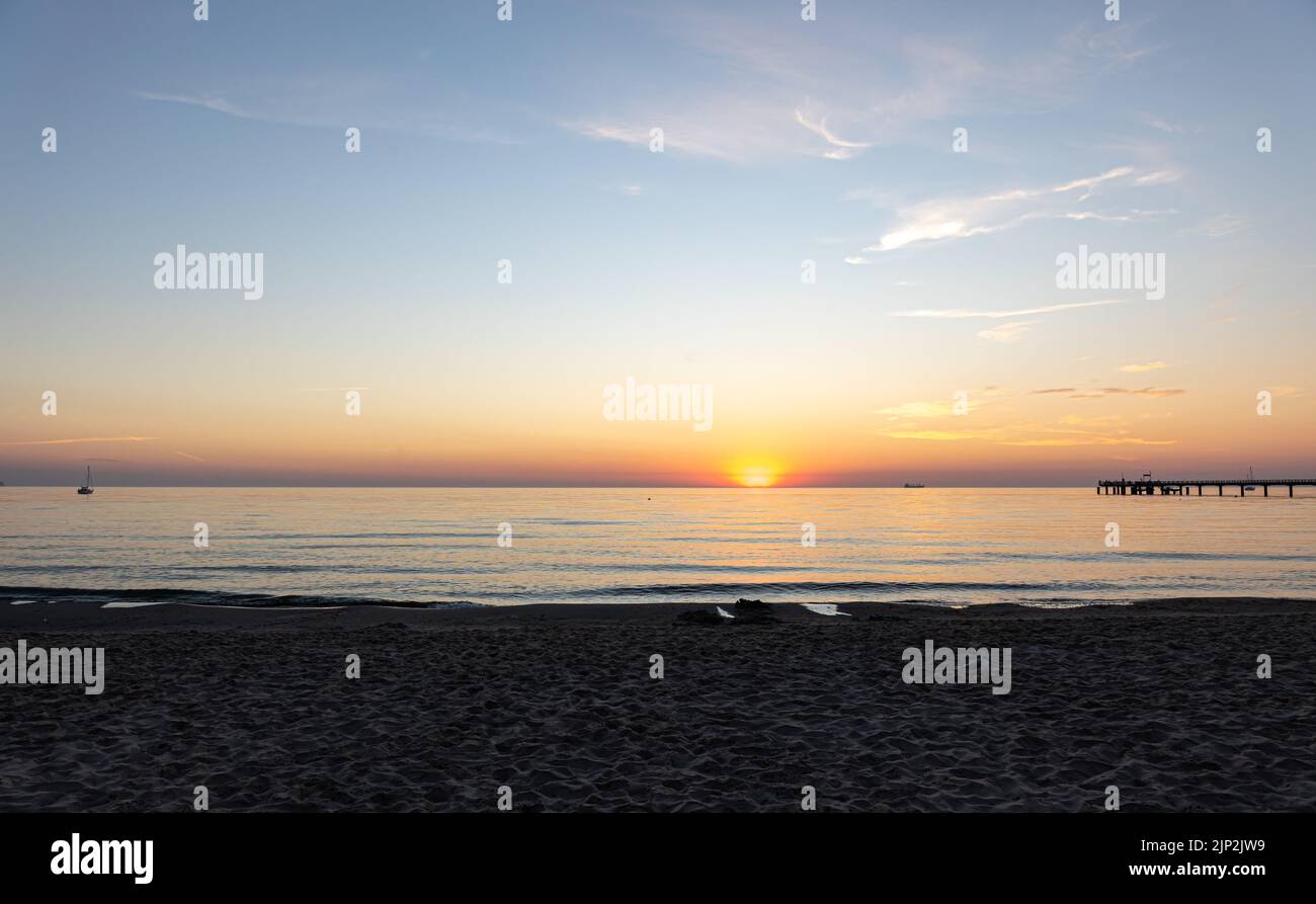 Sea embankment at sunset with a clear cloudless sky Stock Photo - Alamy