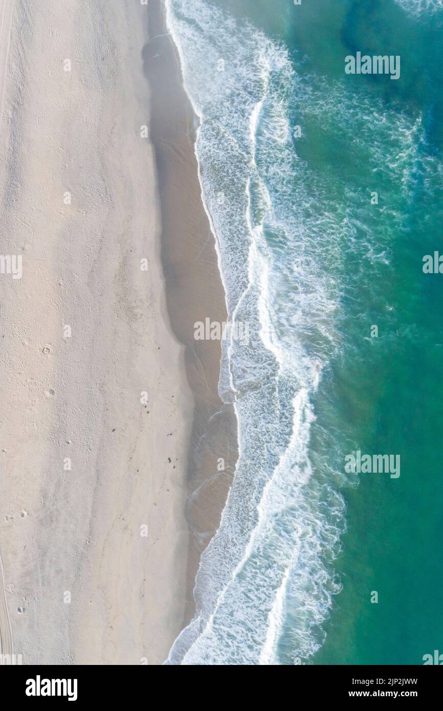 Aerial view of sandy beach and ocean with waves Stock Photo - Alamy