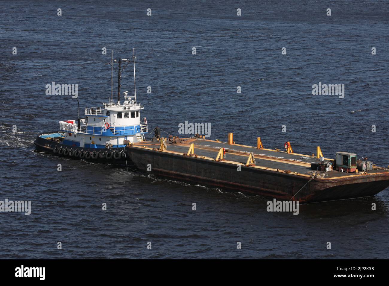 view of Tugboat pushing a heavy barge on the sea, florida usa Stock ...