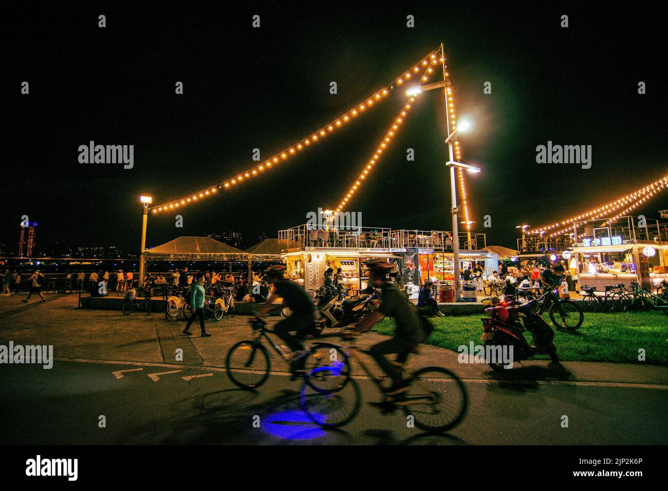 A view of people enjoying their time along the riverside at Pier 5 ...