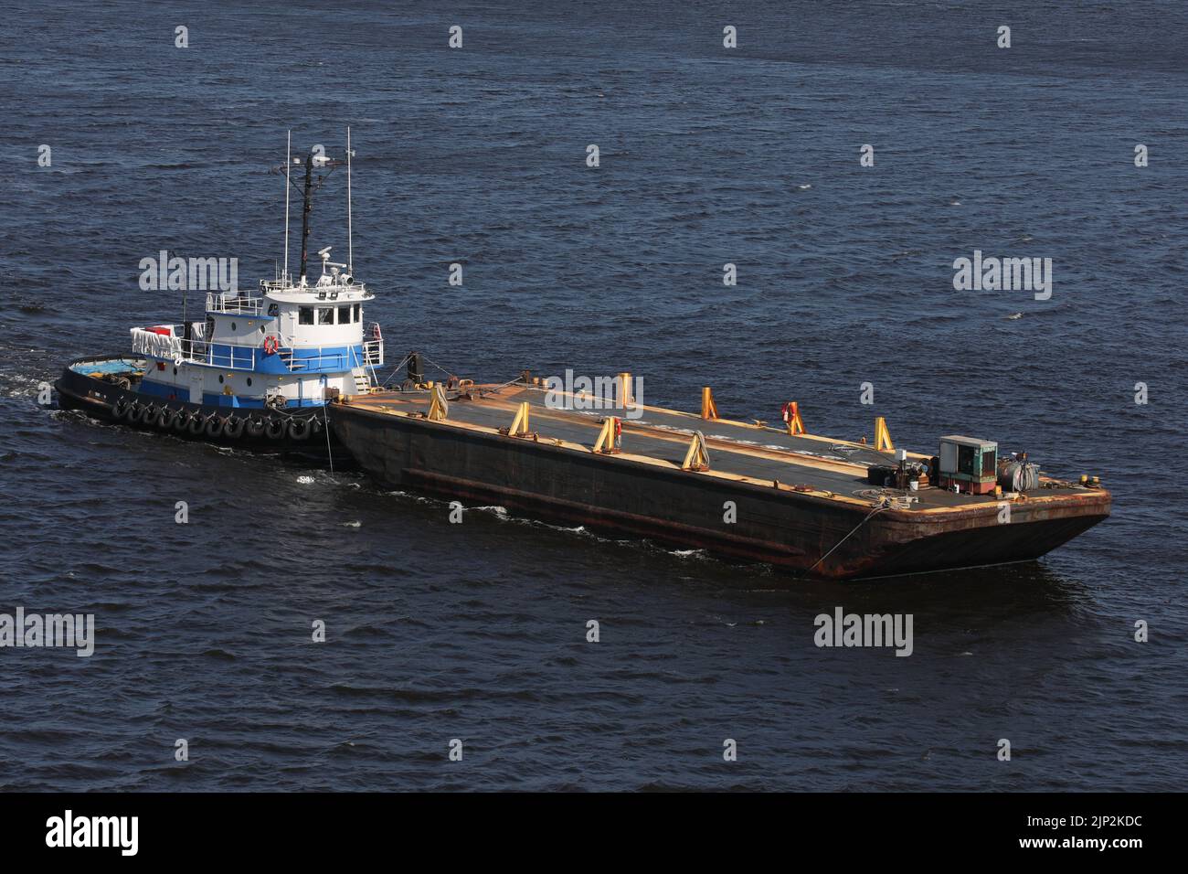 view of Tugboat pushing a heavy barge on the sea, florida usa Stock ...
