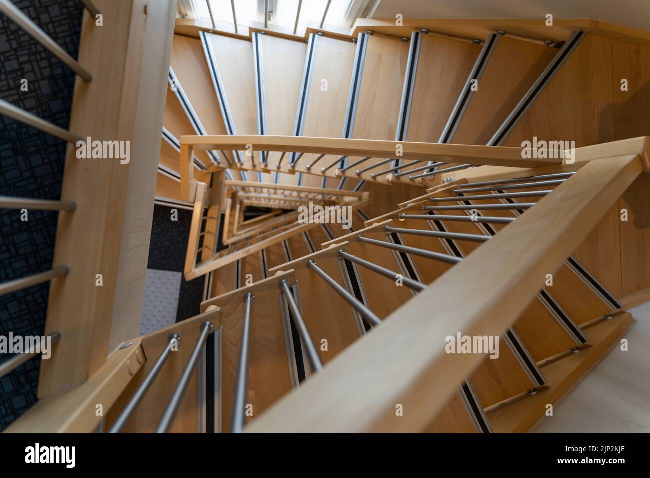 A top view of a lovely wooden staircase with winder steps in a modern ...