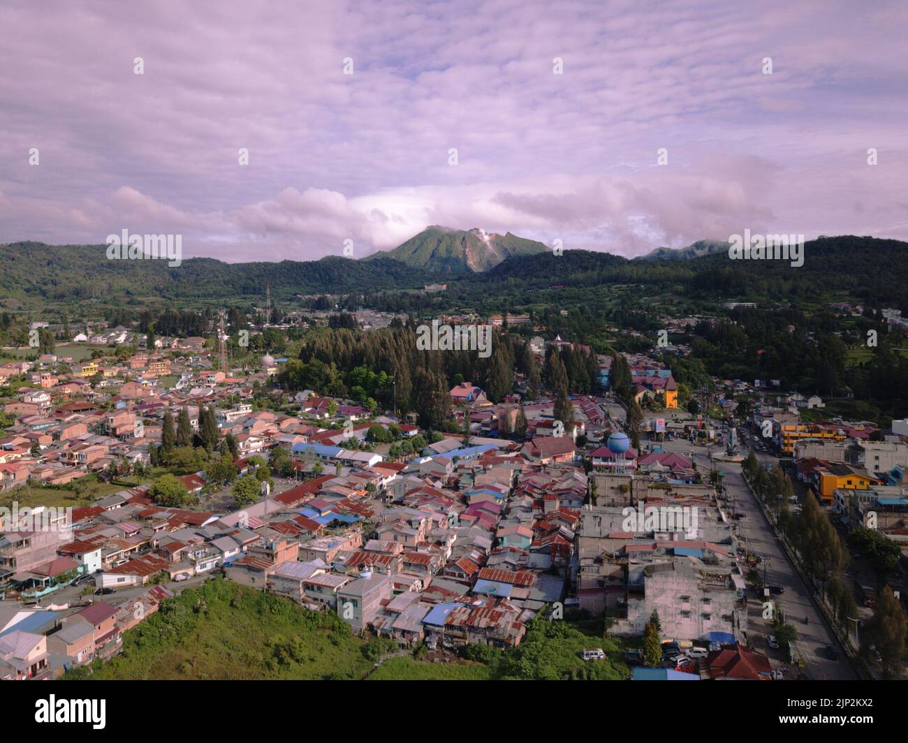 An aerial view of Berastagi town with Sinabung volcano in the ...