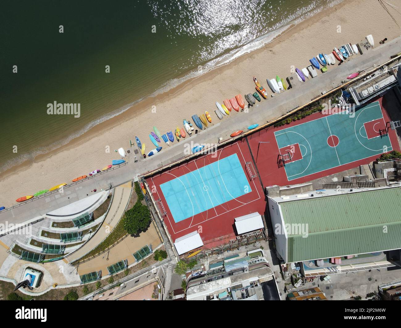 An aerial birds eye view of a recreation area next to the beach on a ...