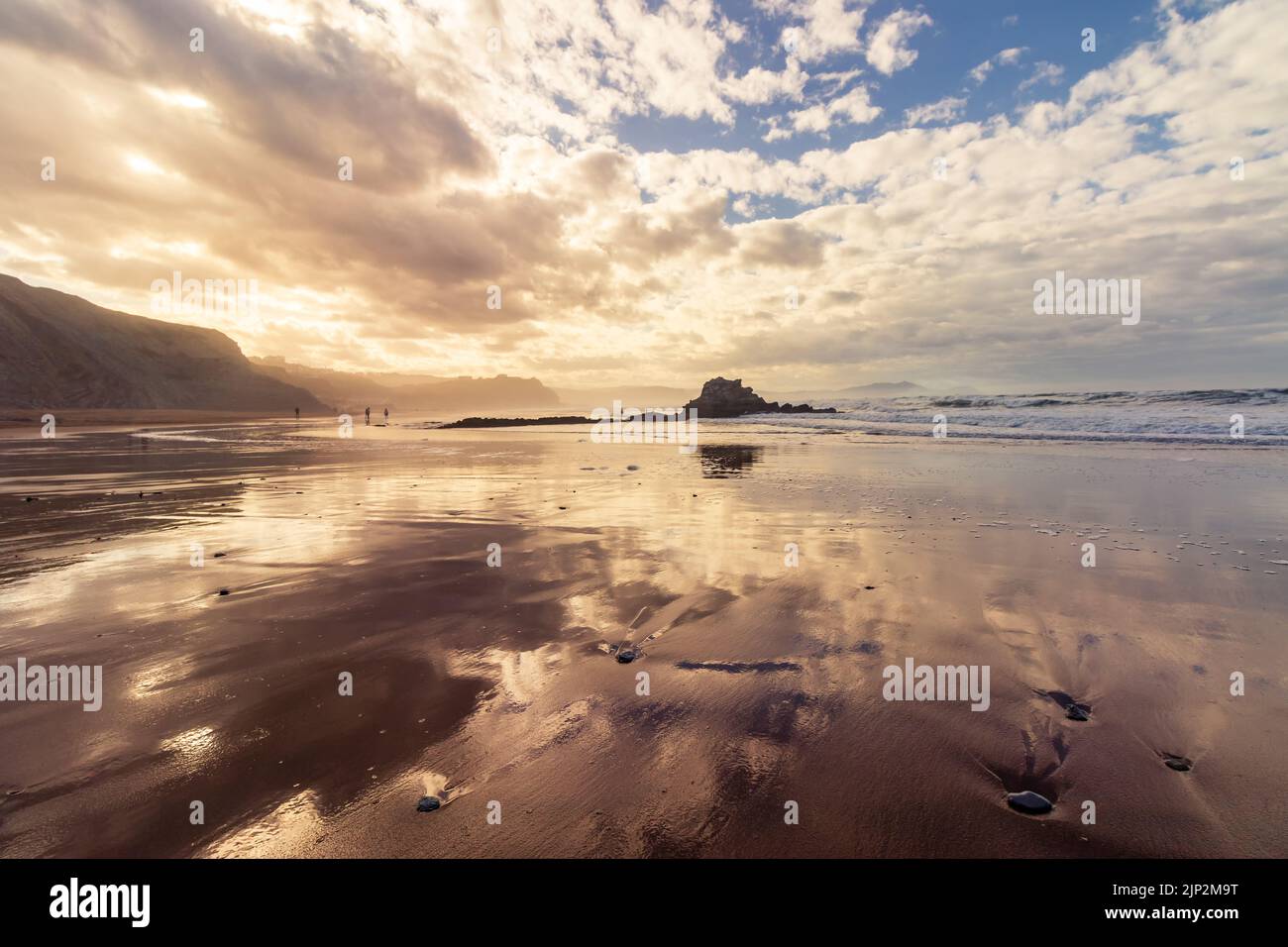 Beach and sea landscape with rocks, reflections in the sand, very ...