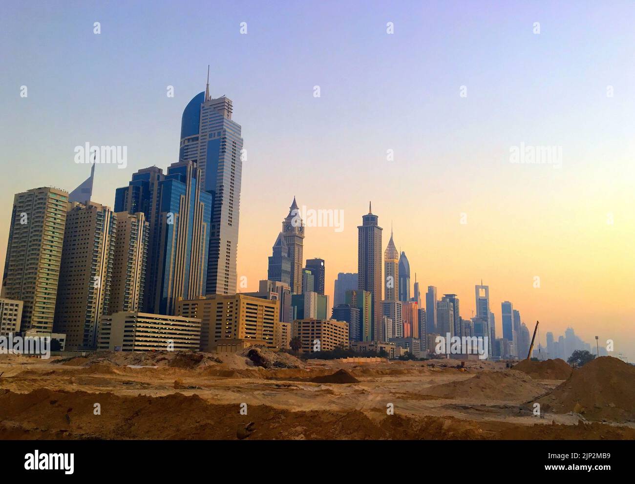 Modern buildings along Sheikh Zayed Road in Dubai at sunset with a ...