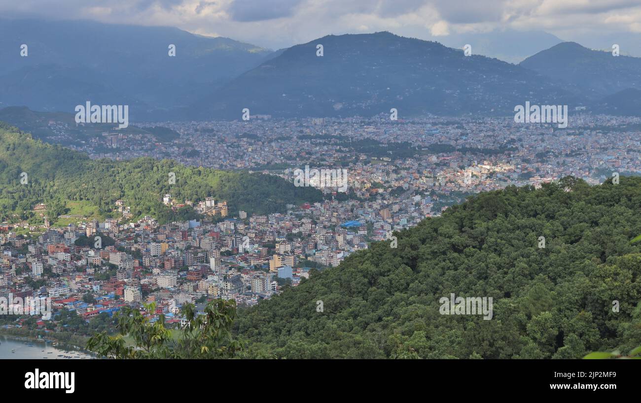 The aerial view of Pokhara city surrounded by green hills. Nepal Stock ...