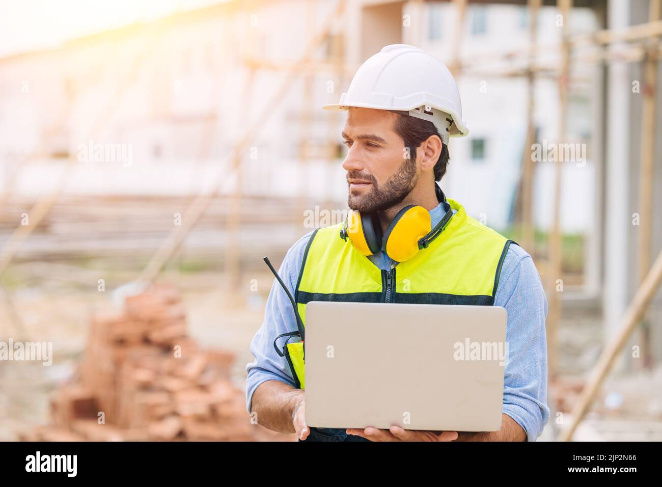 Engineer builder. Happy Foreman work in construction site. senior ...