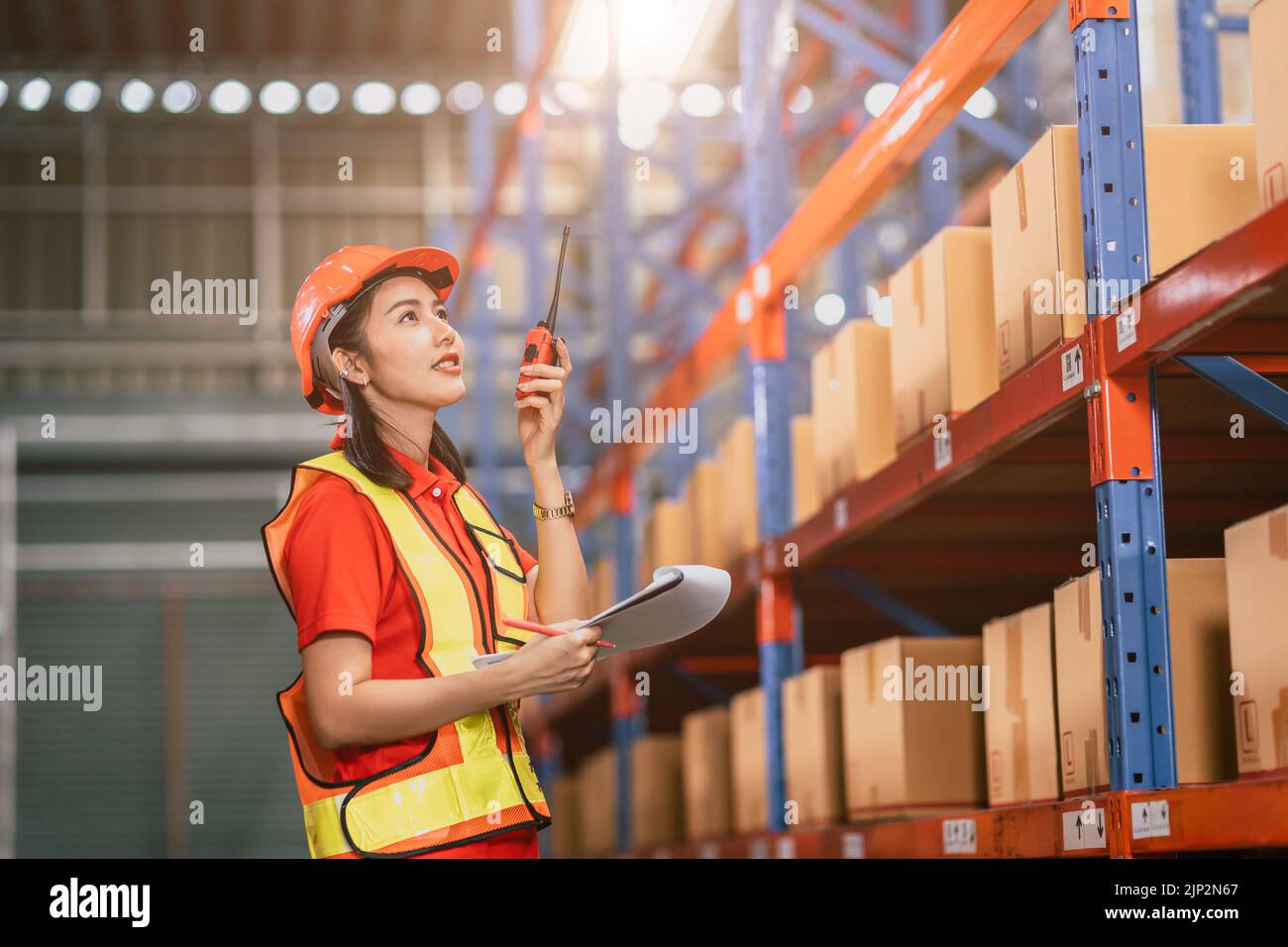 Warehouse woman foreman staff worker work in cargo inventory products ...