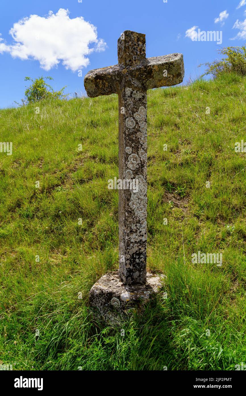Stone cross on the green grass field Stock Photo - Alamy
