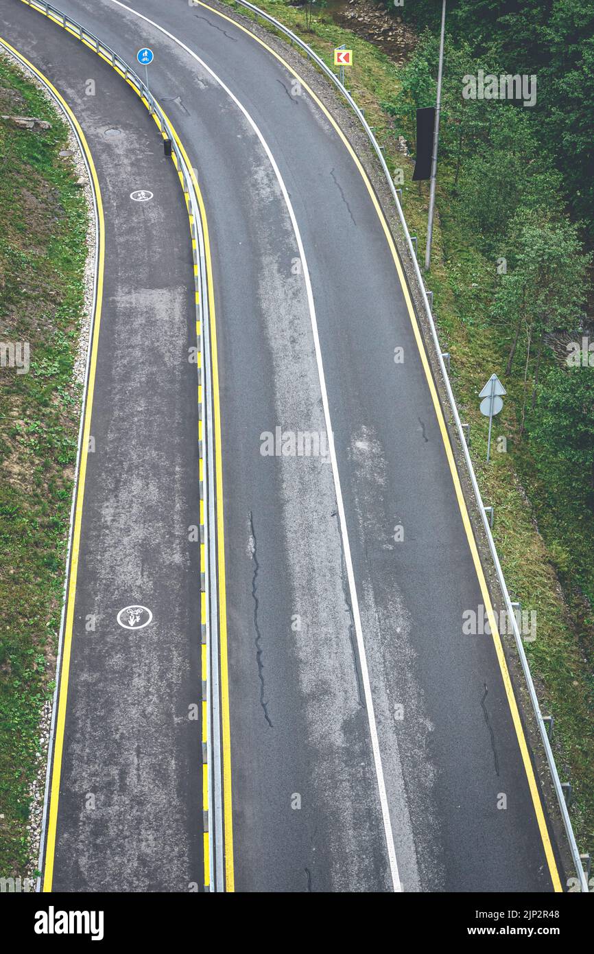 Aerial view winding road green alpine forest summer hi-res stock ...