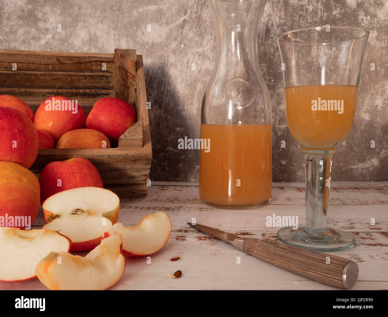 Apples are cut into small pieces to make apple juice Stock Photo - Alamy