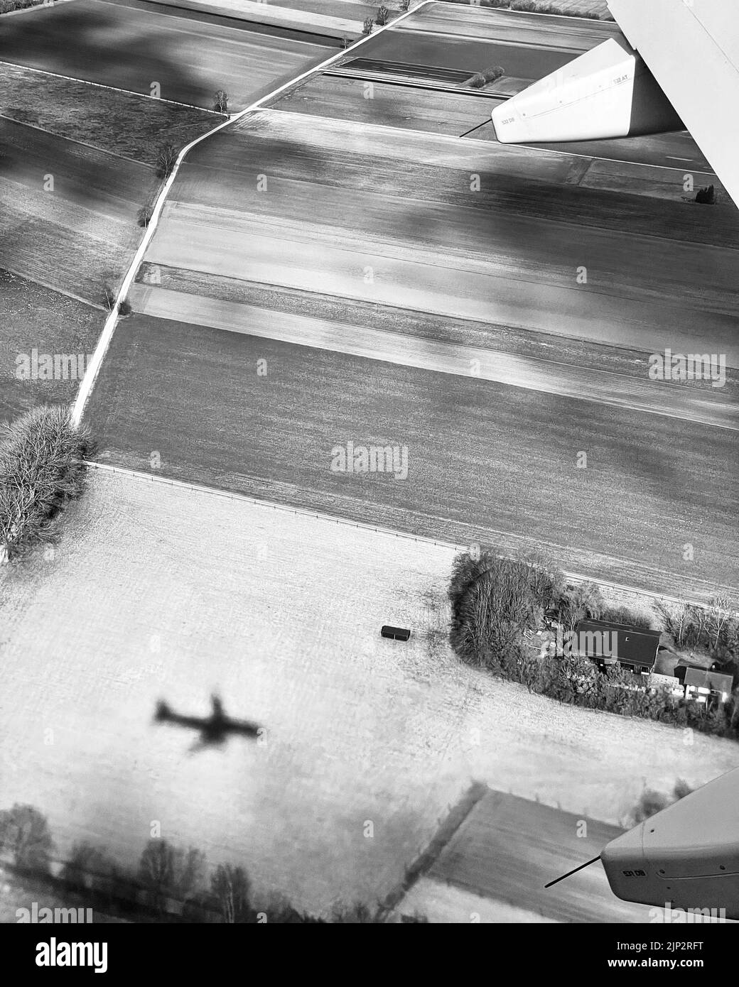 Airplane shadow on field Black and White Stock Photos & Images - Alamy