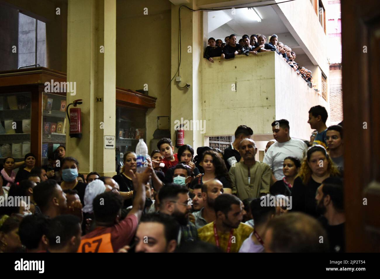 Cairo, Egypt. 15th Aug, 2022. People gather at the site after a fire ...