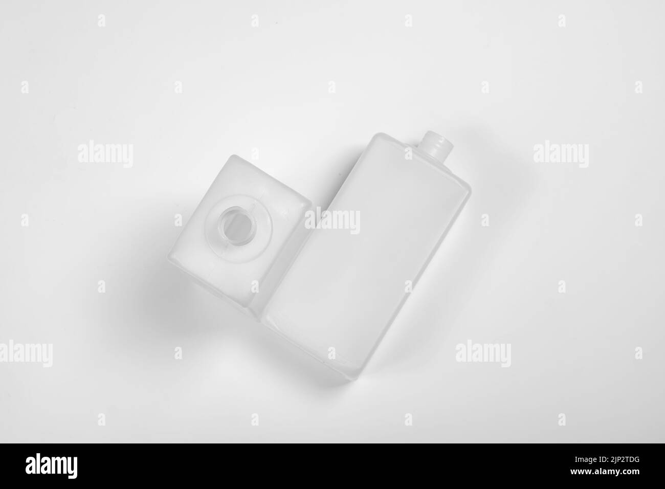 A top view of High-Density Poly Ethylene plastic bottles on white ...