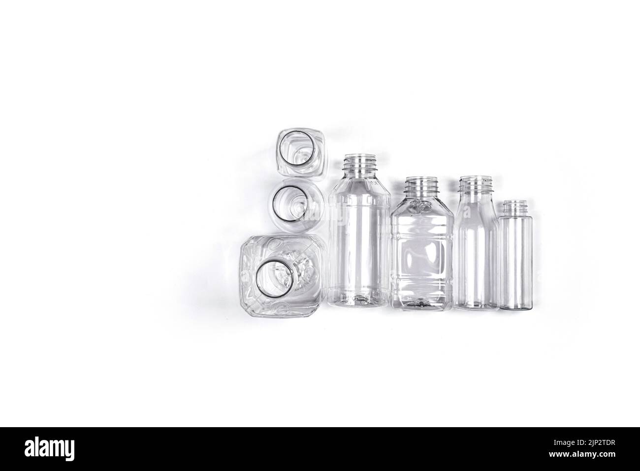 A top view of plastic packaging bottles isolated on white background ...