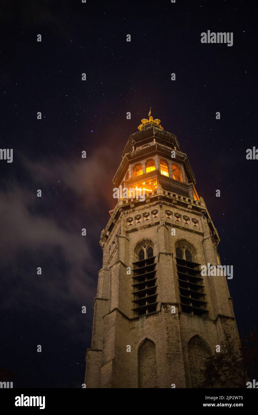 A low-angle shot of Tall John Abbey Tower with lights sparkling at ...