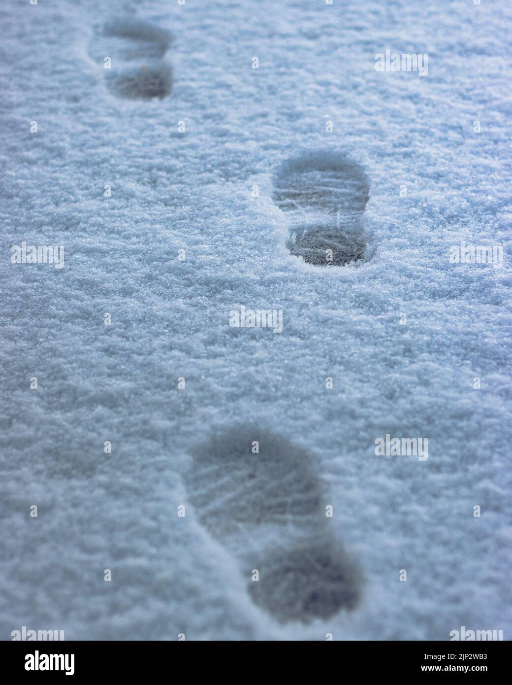 The child footprints in the snow Stock Photo - Alamy
