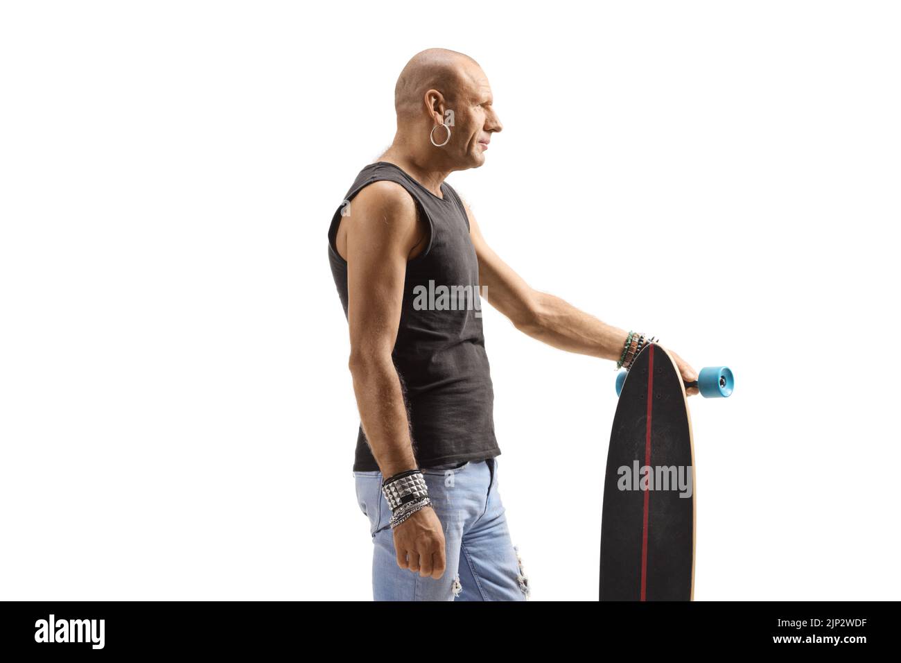 Bald man standing and holding a longboard isolated on white background ...