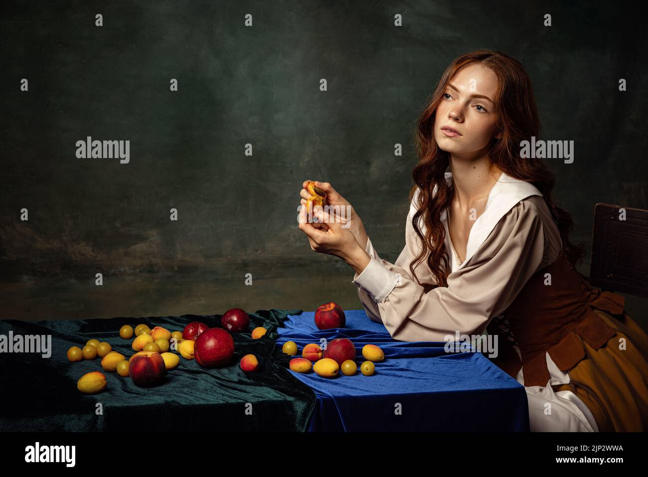 Vintage style portrait of pretty redhead woman with long curly hair ...