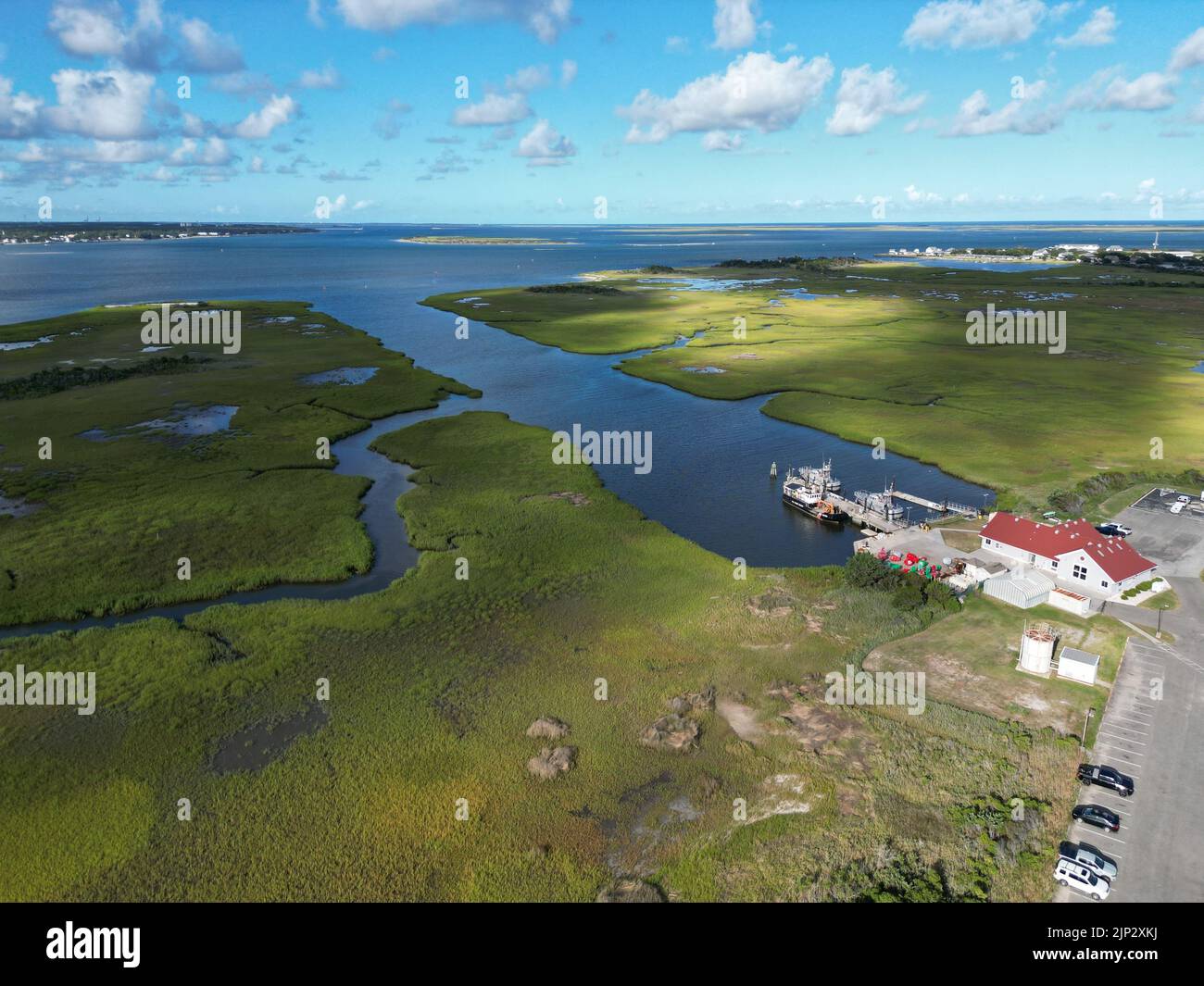 An inlet that links to the ocean with a ship ready to leave it Stock ...