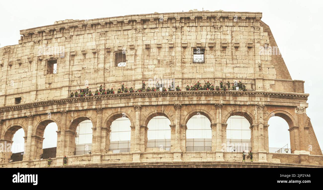 A beautiful view of the historical Coliseum's wall on a gray sky ...