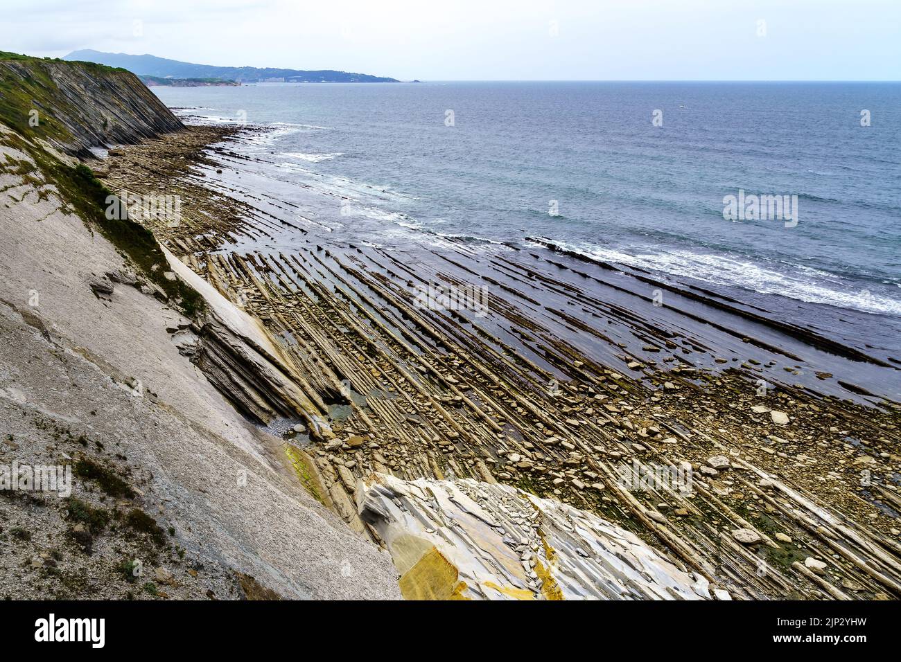 Cliff of karstic formations by the sea in the Basque Country. Spain ...