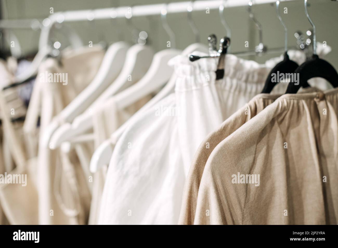 Sustainable fashion, slow fashion. Close Up Shot of Clothing Rack with ...