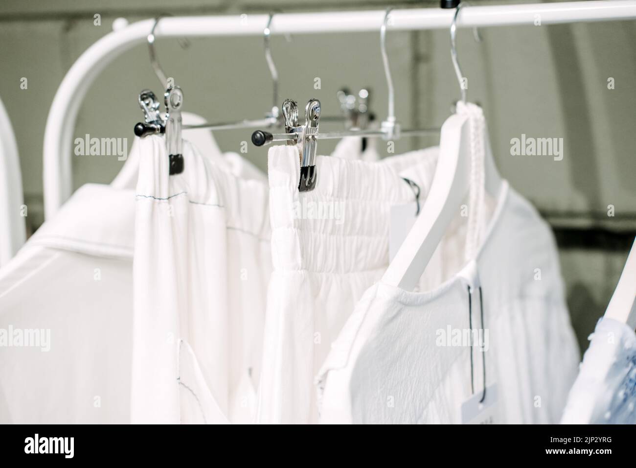 Sustainable fashion, slow fashion. Close Up Shot of Clothing Rack with ...