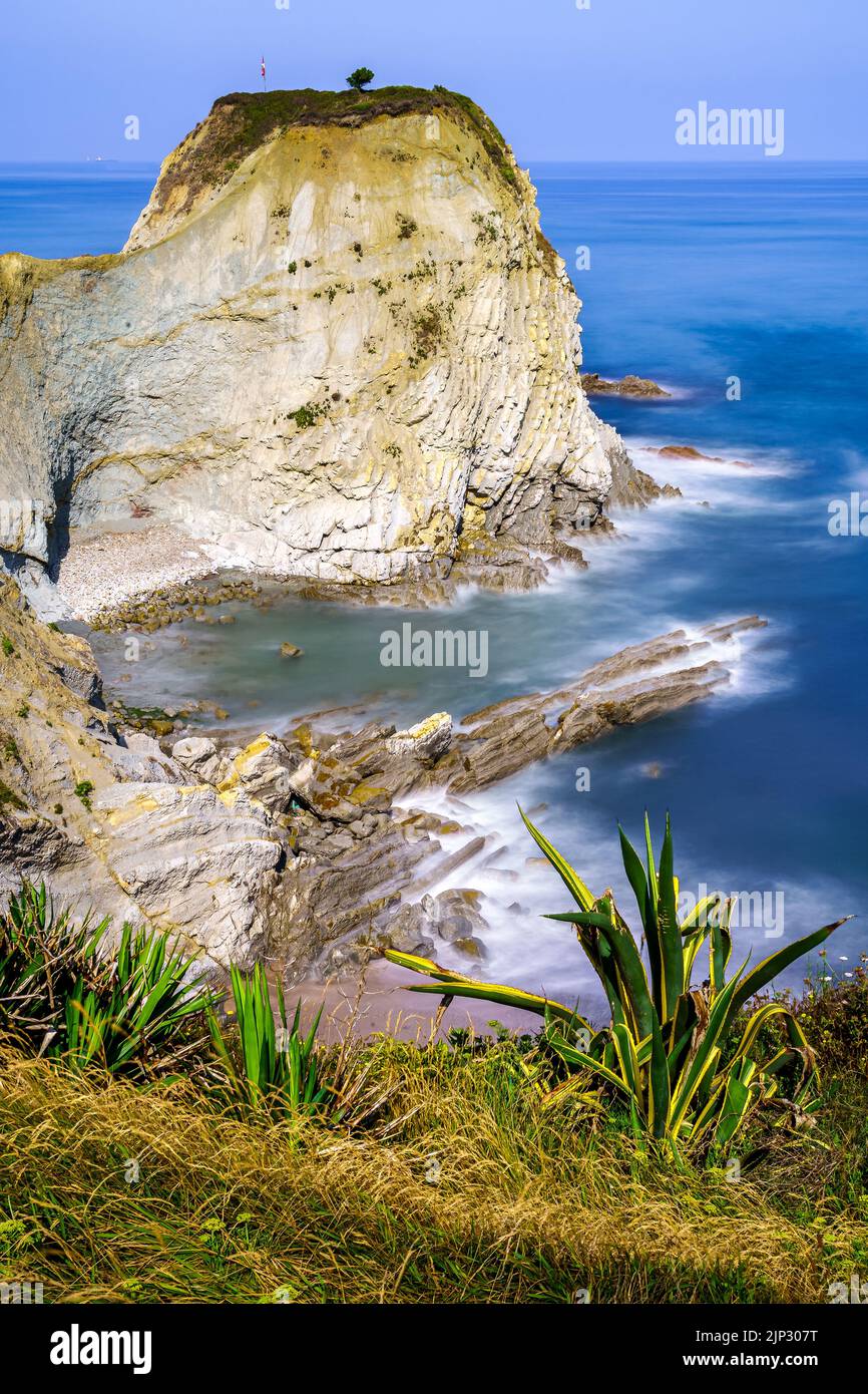 Beach and cliff of Sopelana Basque Country on a summer day with long ...