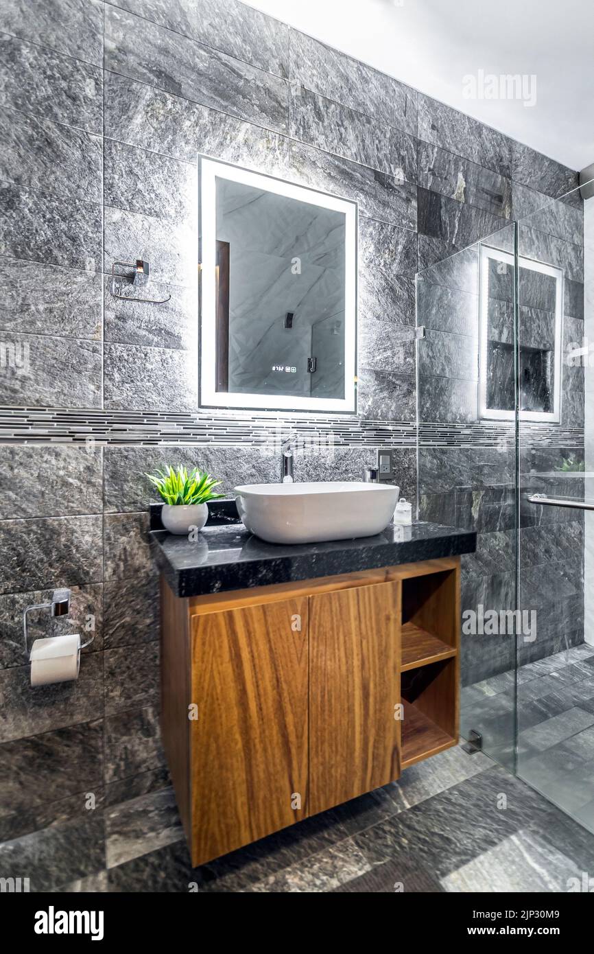 bathroom with luxury finishes, main mirror with led light from behind ...