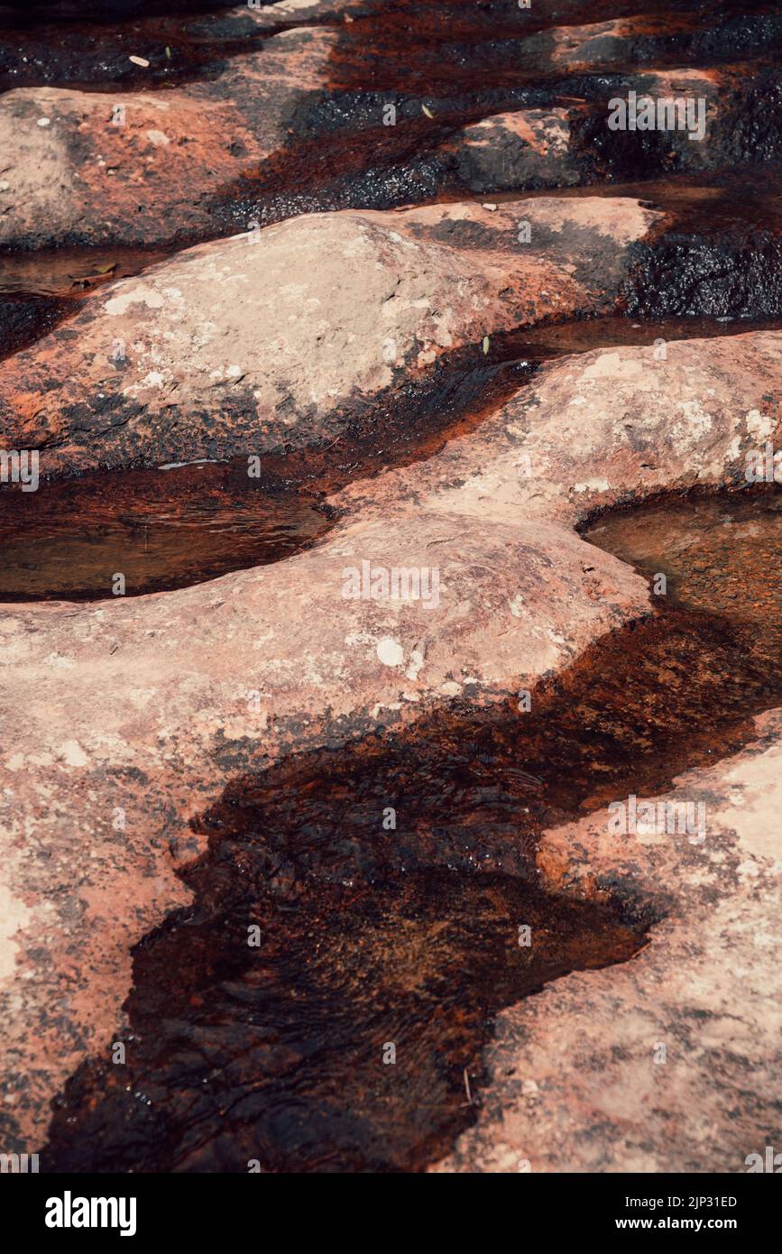 A vertical shot of the natural brown wet stoned ground Stock Photo - Alamy