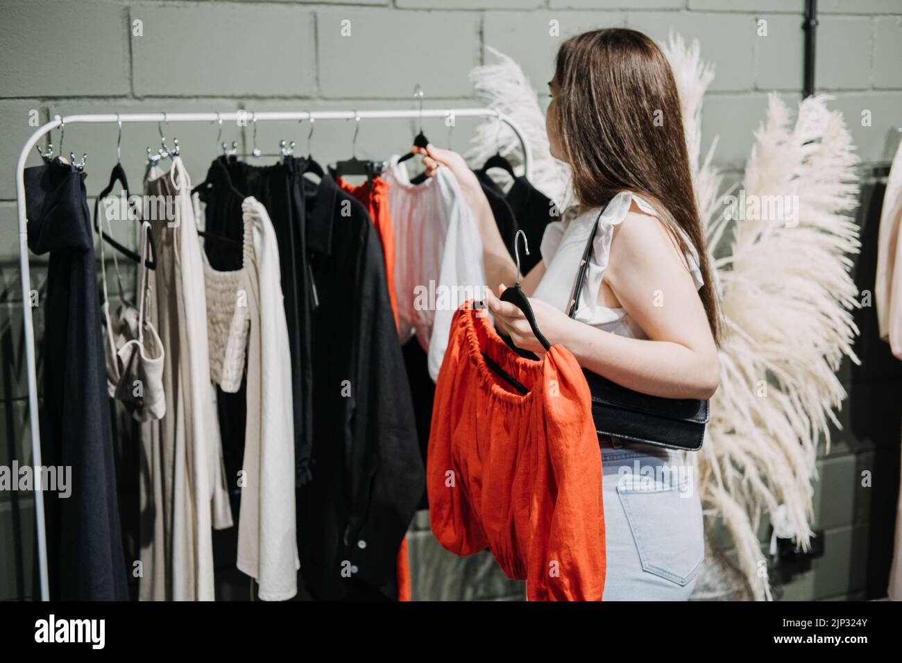 Sustainable fashion, slow fashion, Conscious shopping. Young Latina ...