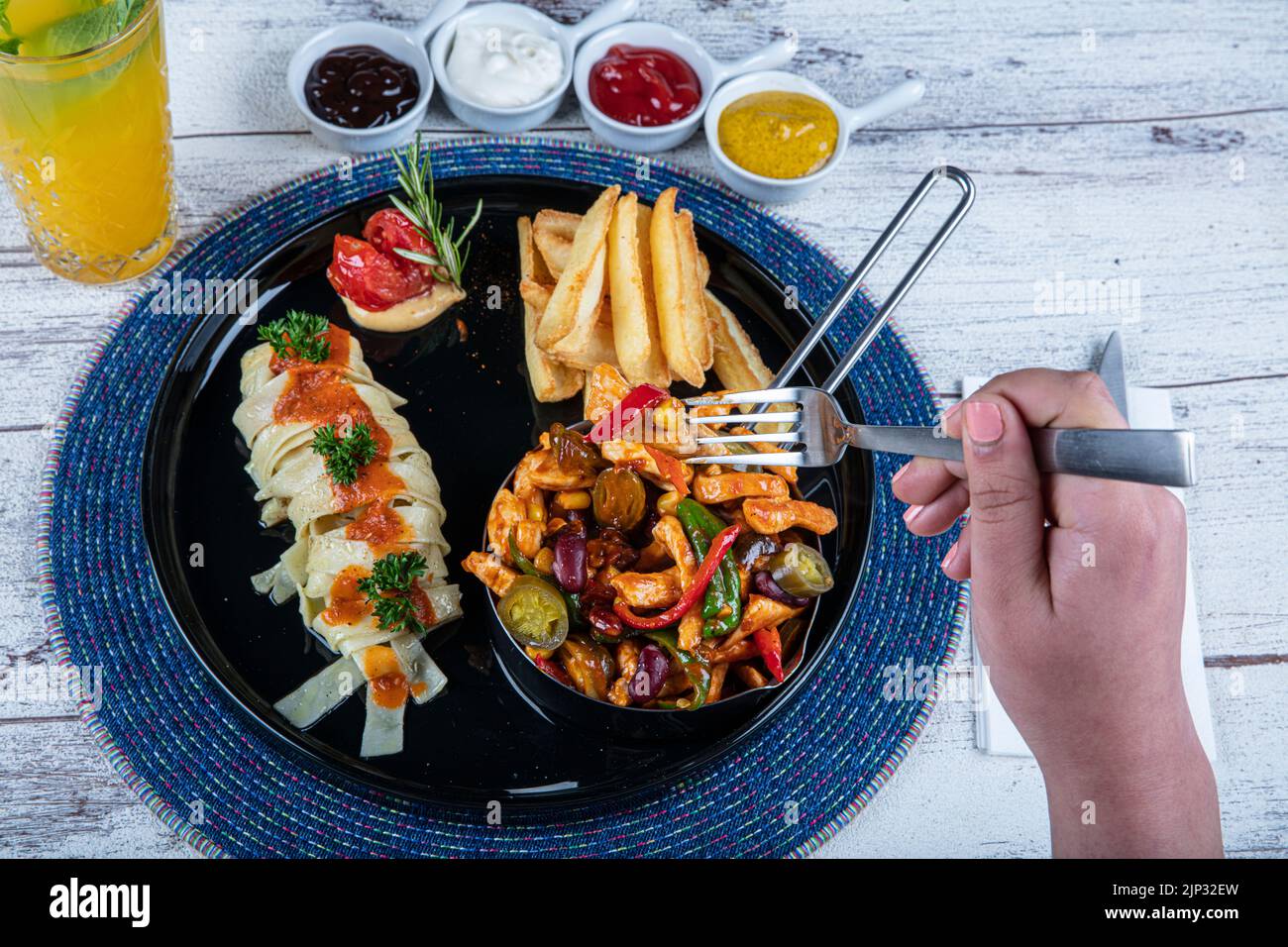 Fried Chicken with Hot Pepper Sauce. The appetizer is served with ...