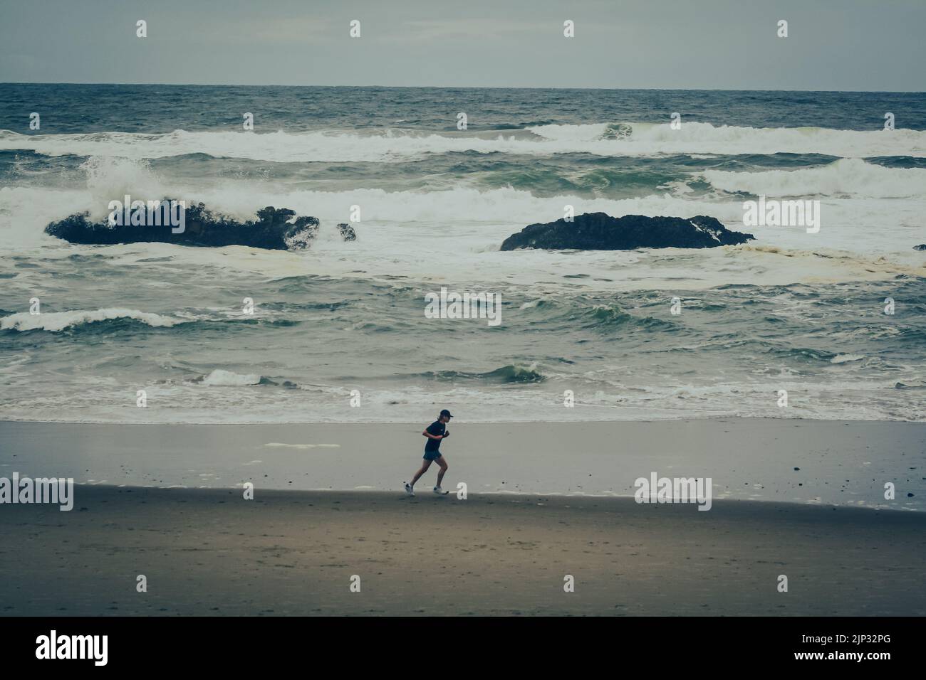 Runner in the beach hi-res stock photography and images - Alamy