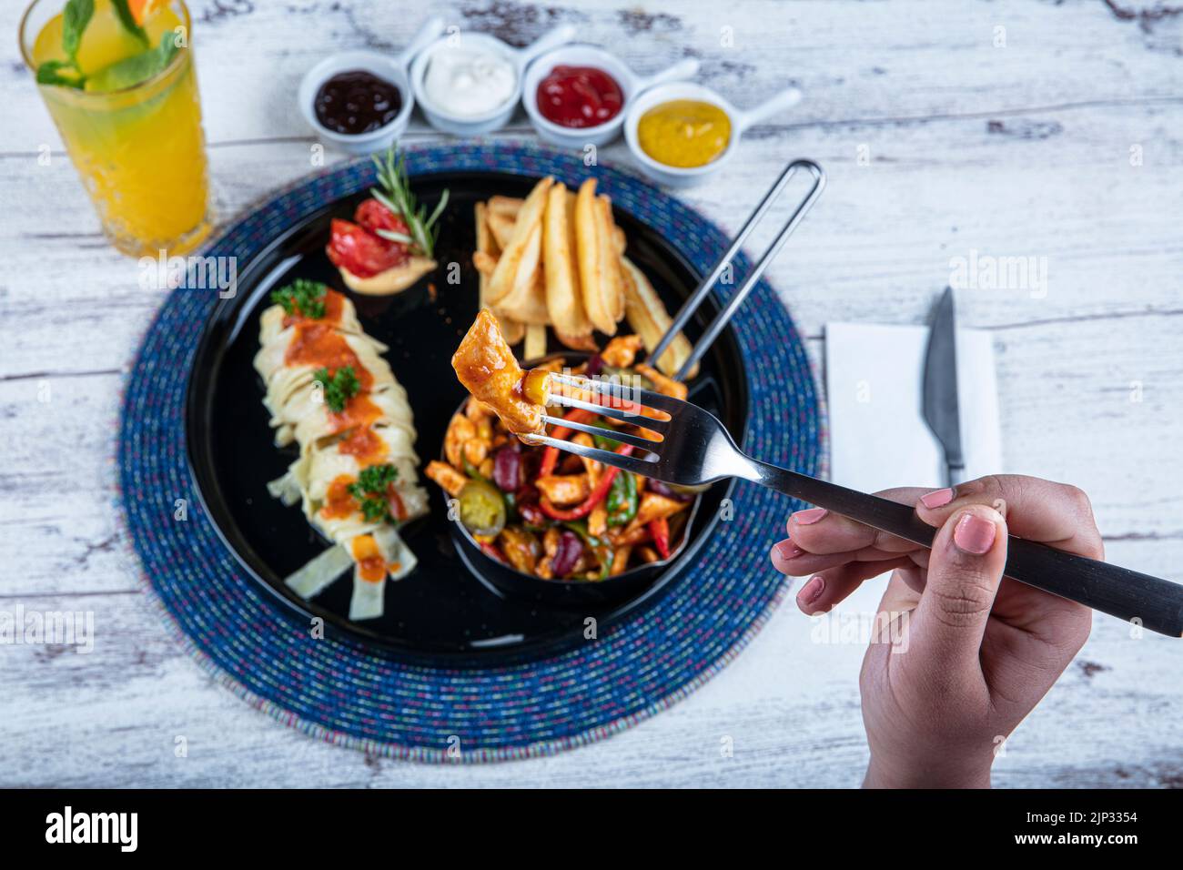 Fried Chicken with Hot Pepper Sauce. The appetizer is served with ...